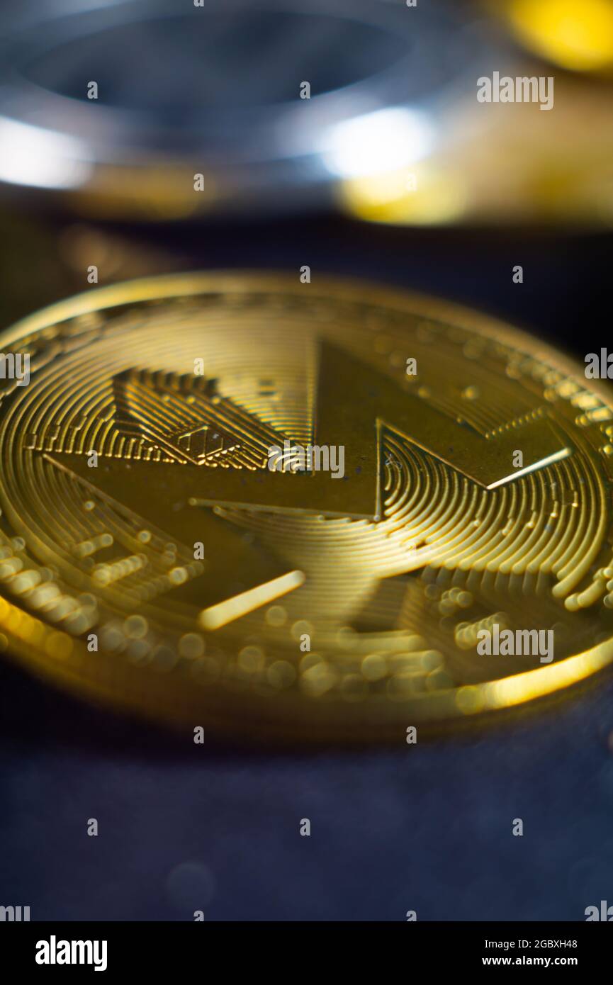 Vertical shot of a gold bitcoin Stock Photo - Alamy
