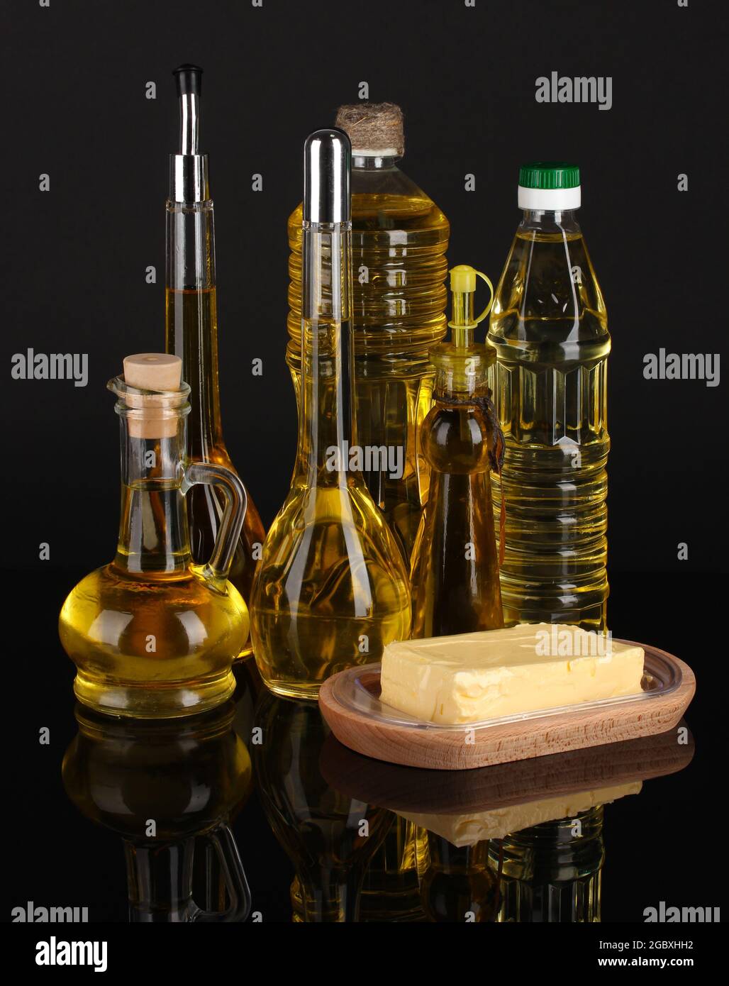 Different types of oil on dark background Stock Photo - Alamy