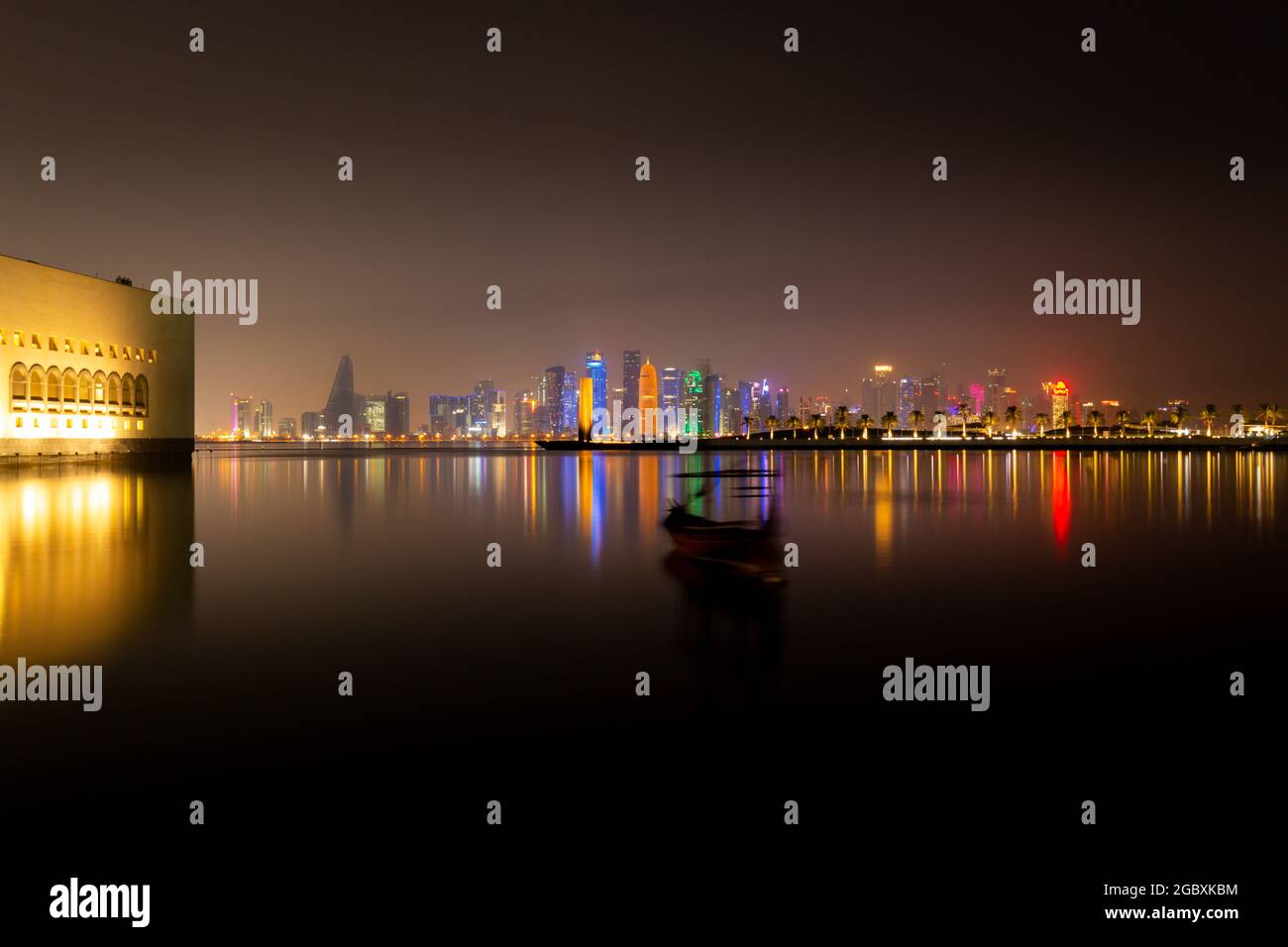 Coloful illuminated skyline of Doha with illuminated Museum of Islamic ...