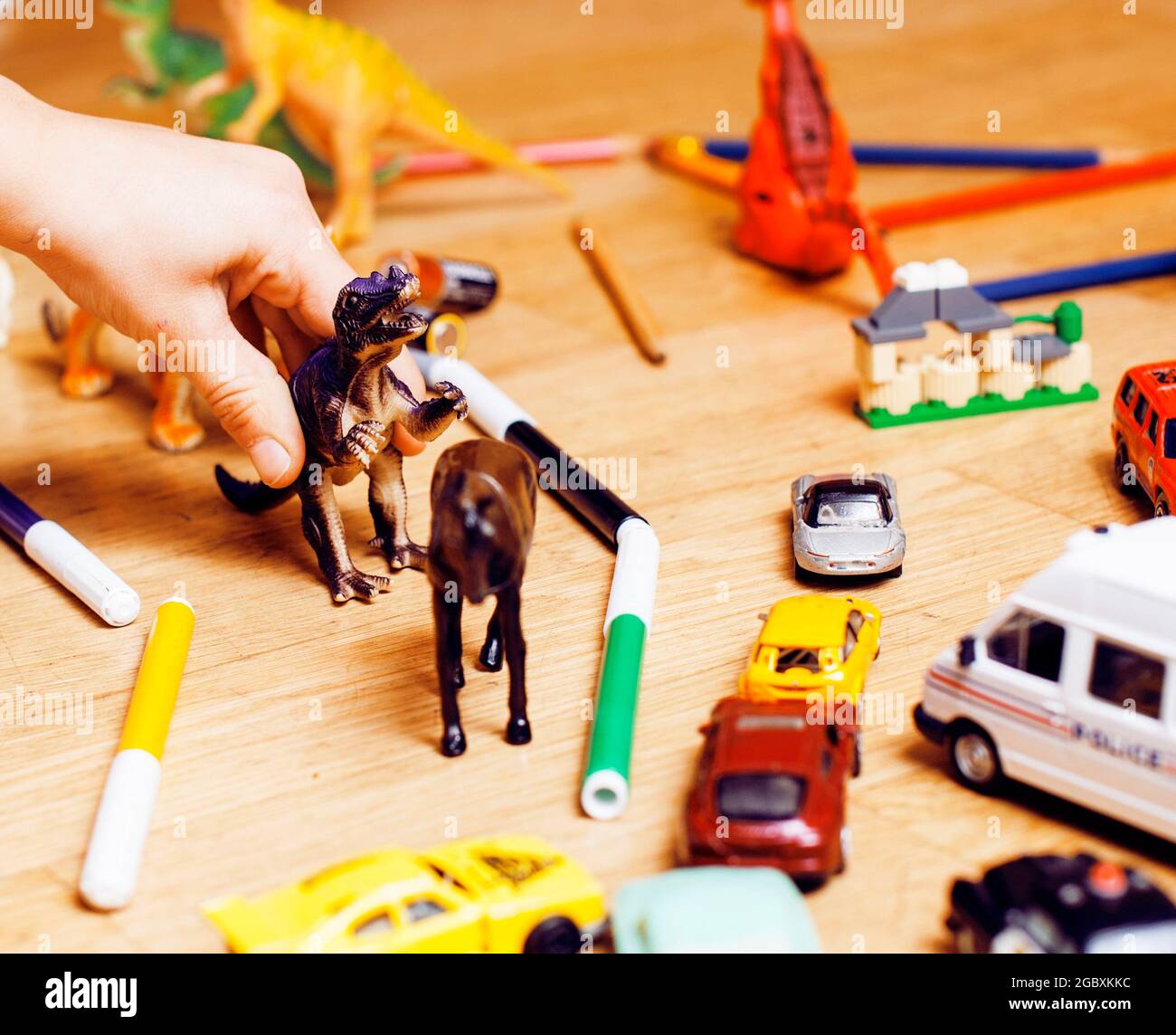 children playing toys on floor at home, little hand in mess, free ...