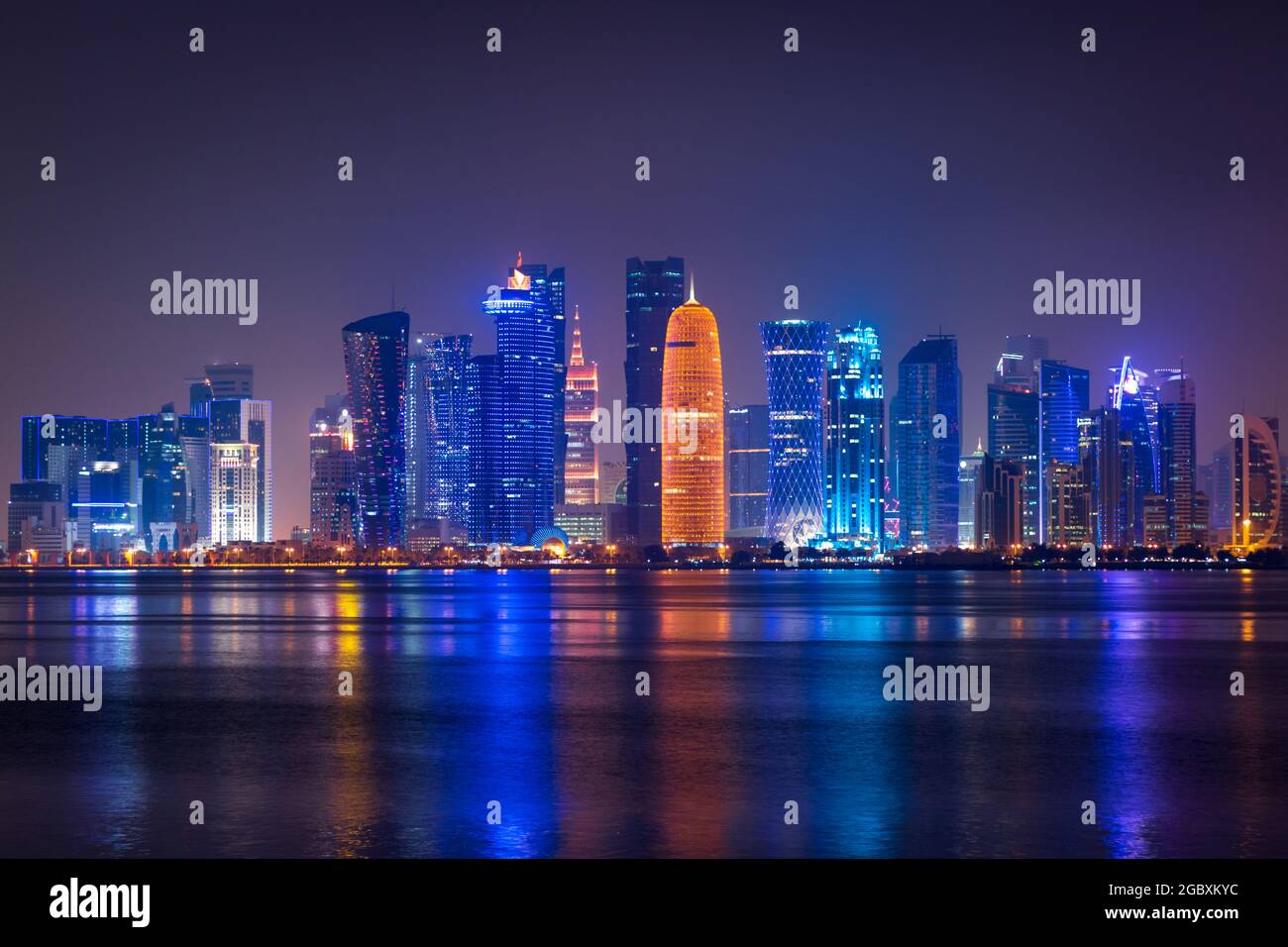 Coloful illuminated skyline of Doha at night, Qatar, Middle East ...