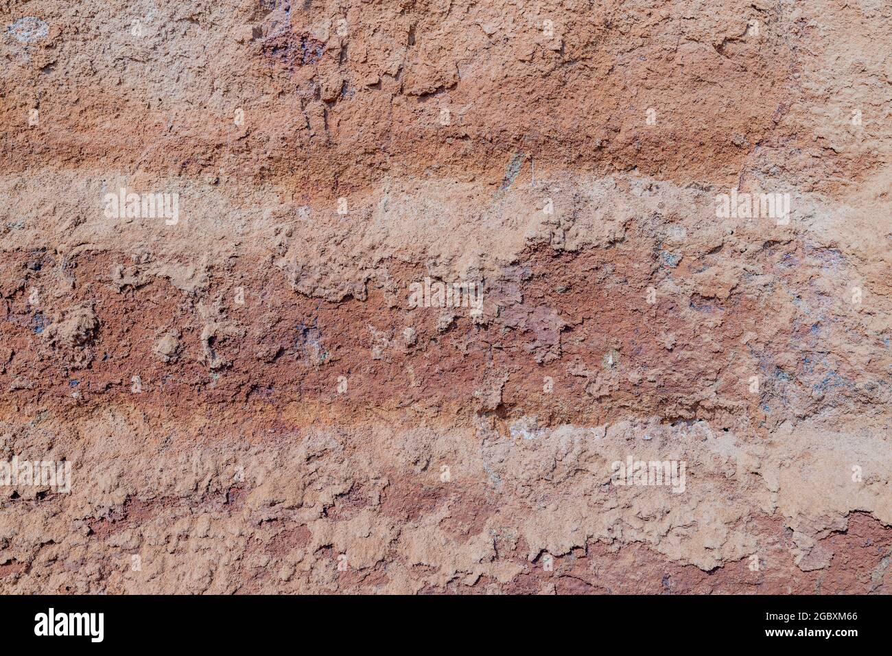 Close up view of sandy clay surface as brown natural texture wallpaper ...