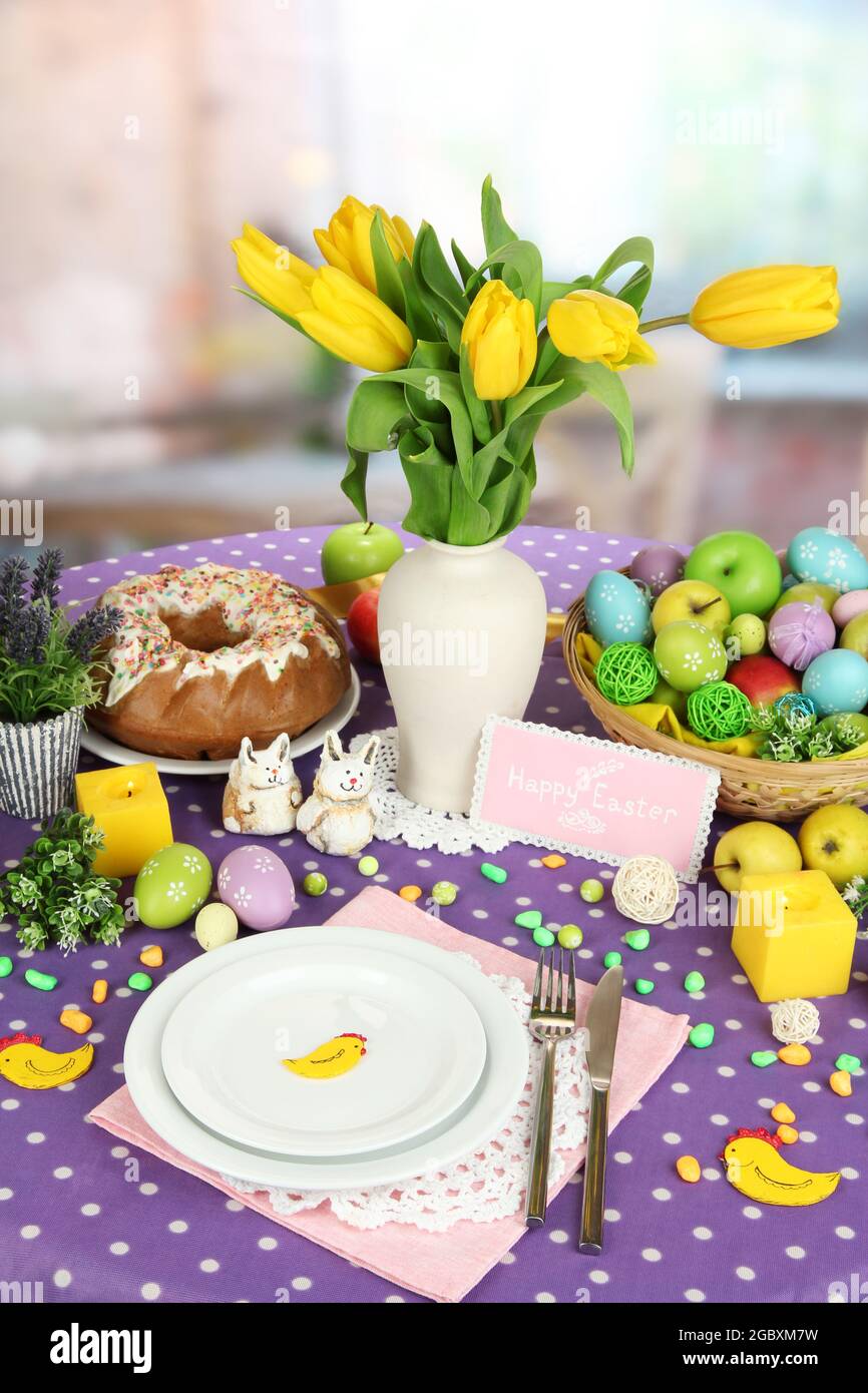 Serving Easter table on room background Stock Photo - Alamy