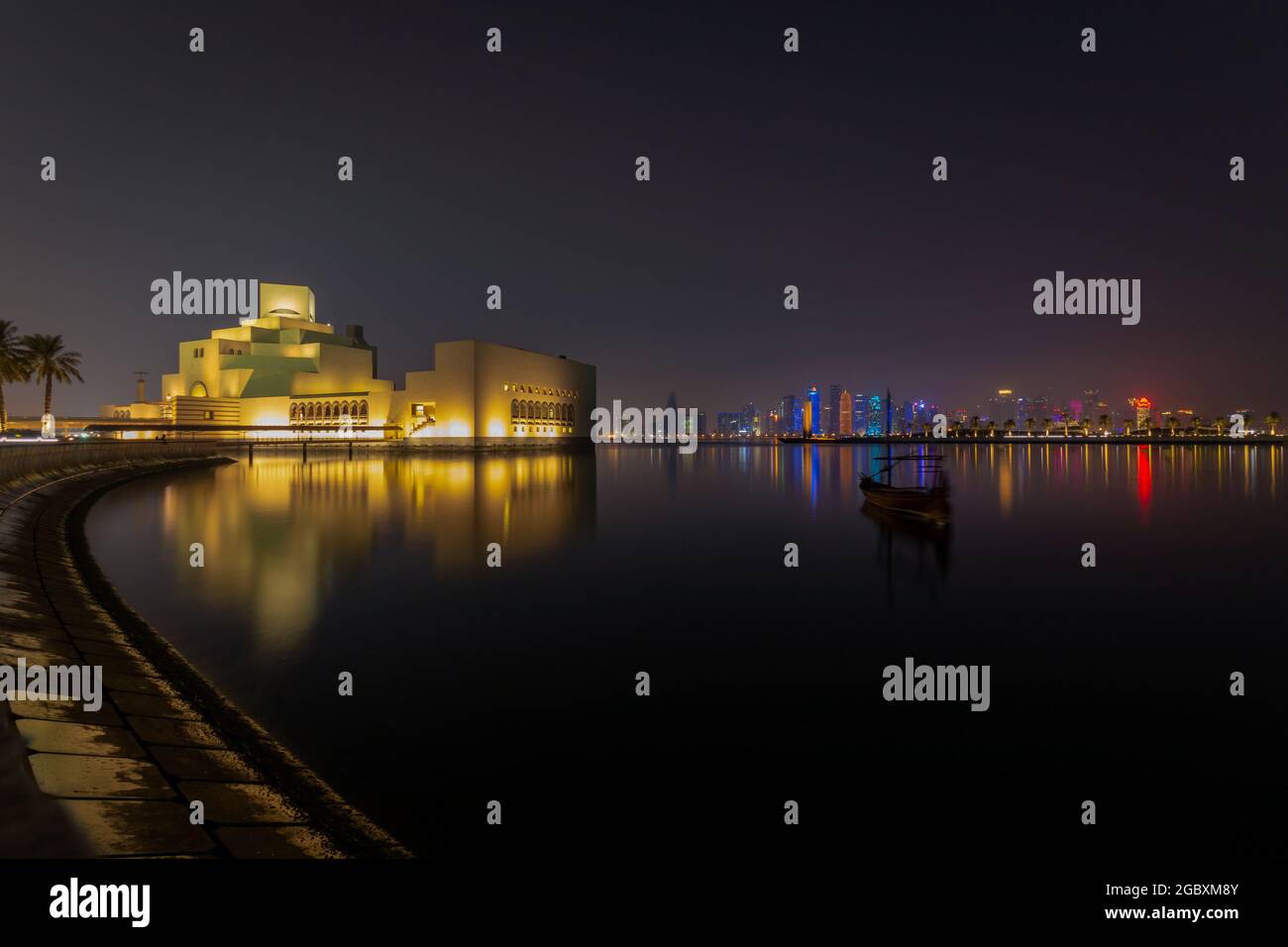 Illuminated Museum of Islamic Art in Doha at night with colorful ...