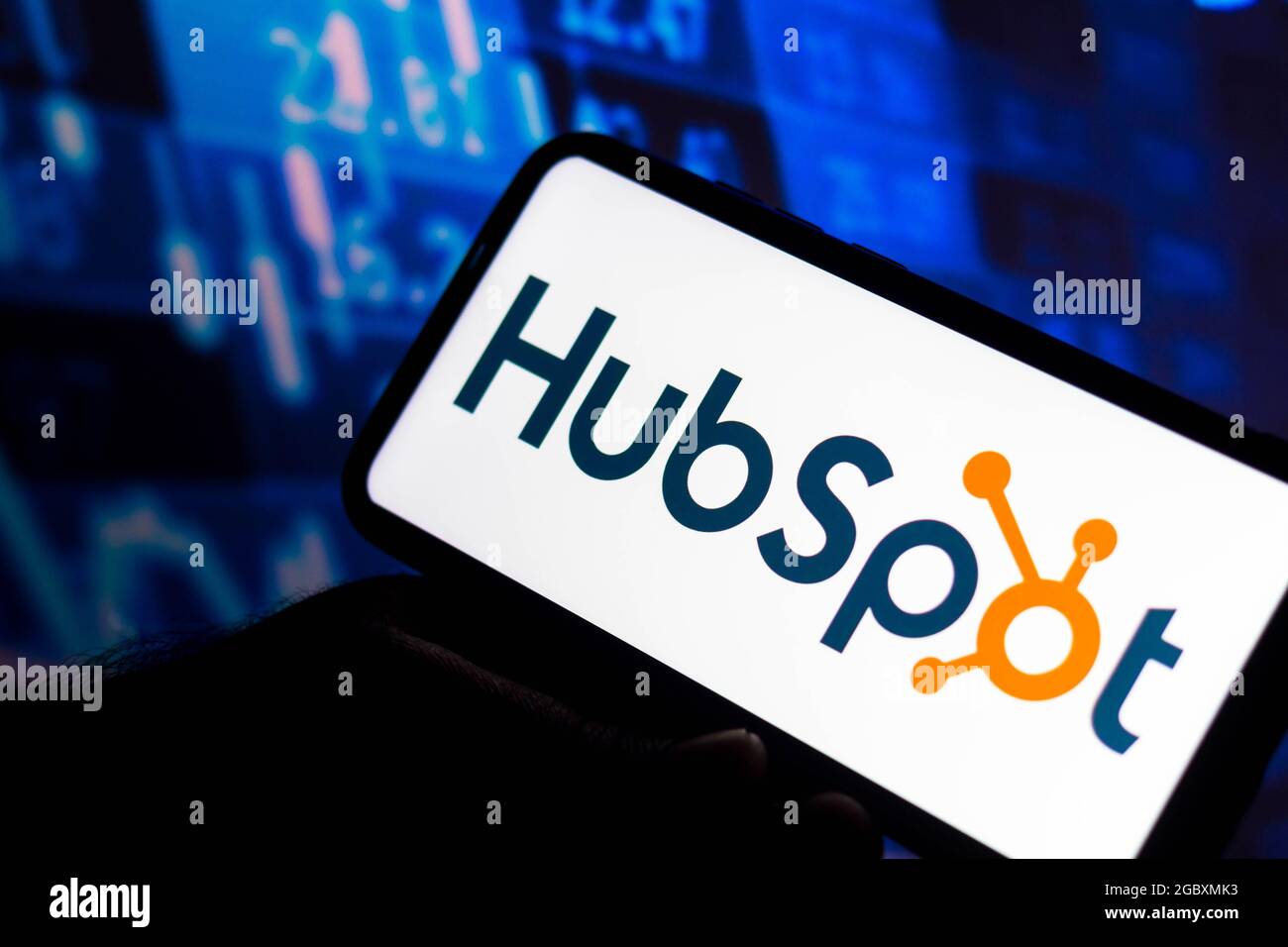In this photo illustration the HubSpot logo seen displayed on a ...