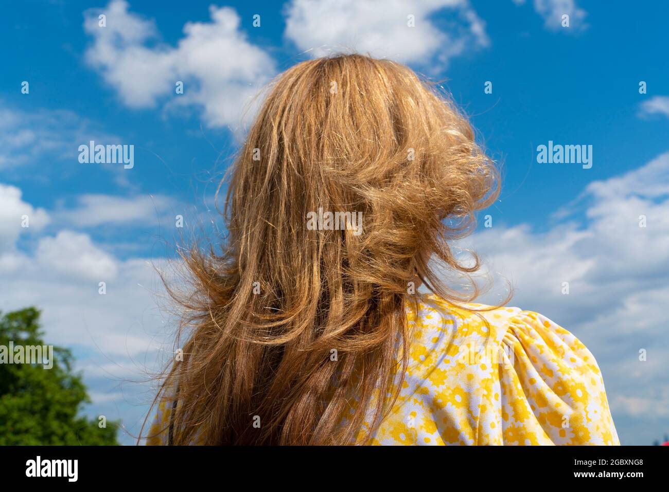 Blonde Woman Blue Sky Stock Photo - Alamy