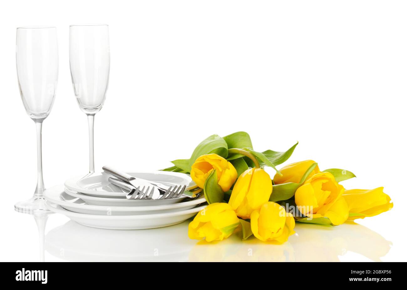 Yellow tulips and utensils for serving isolated on white Stock Photo ...