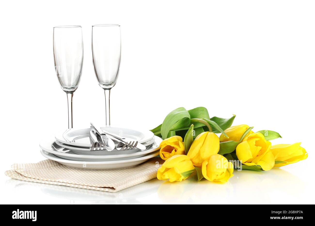 Yellow tulips and utensils for serving isolated on white Stock Photo ...