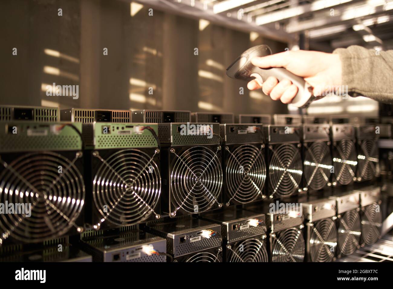 Controller in uniform scans ASIC bitcoin miners with barcode scanner in ...