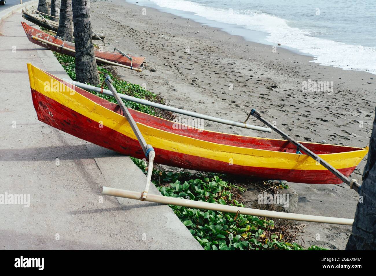 Fishing boats are moored on a Dili, Timor Leste beach Stock Photo - Alamy