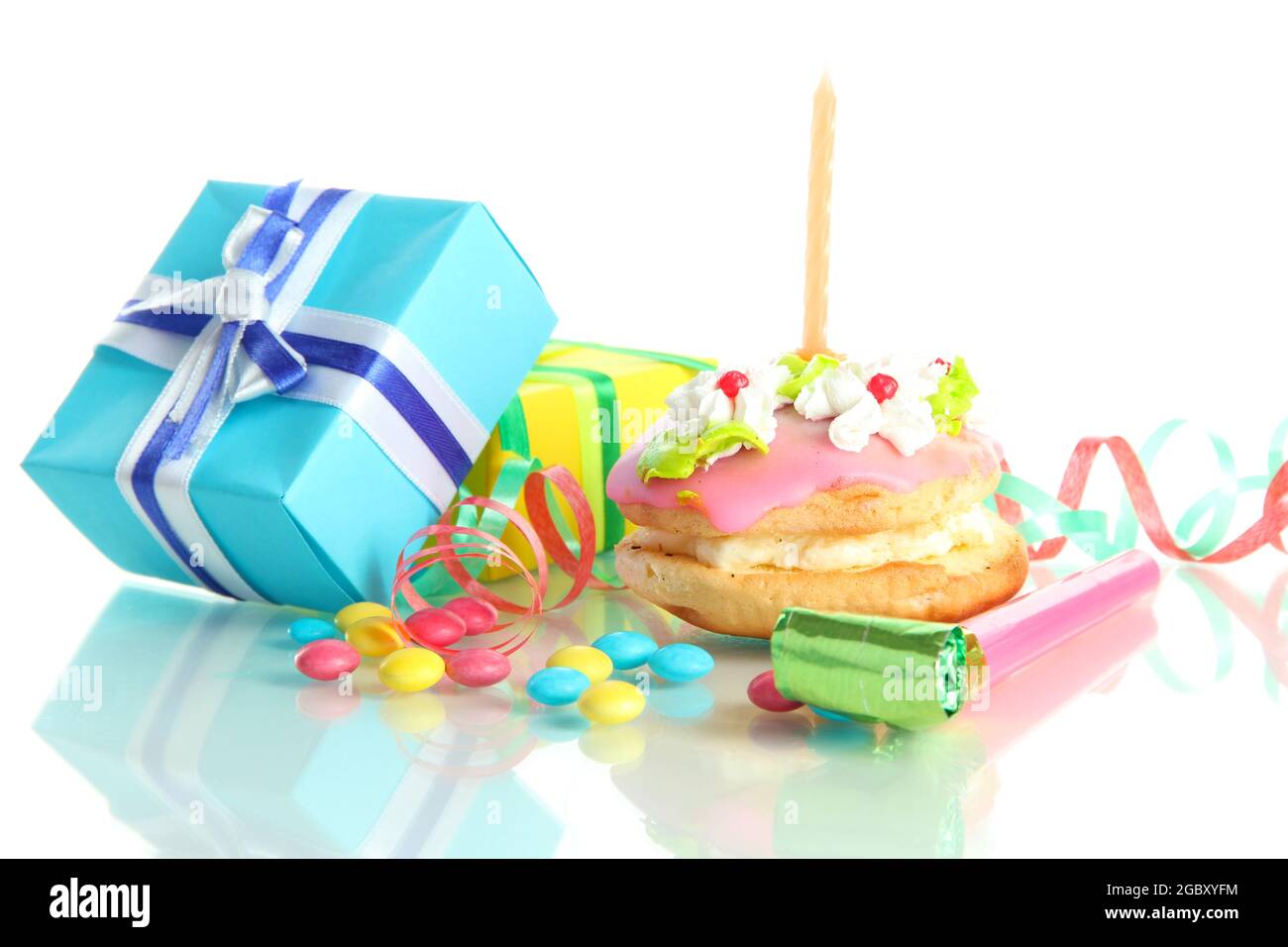 Colorful birthday cake with candle and gifts isolated on white Stock ...