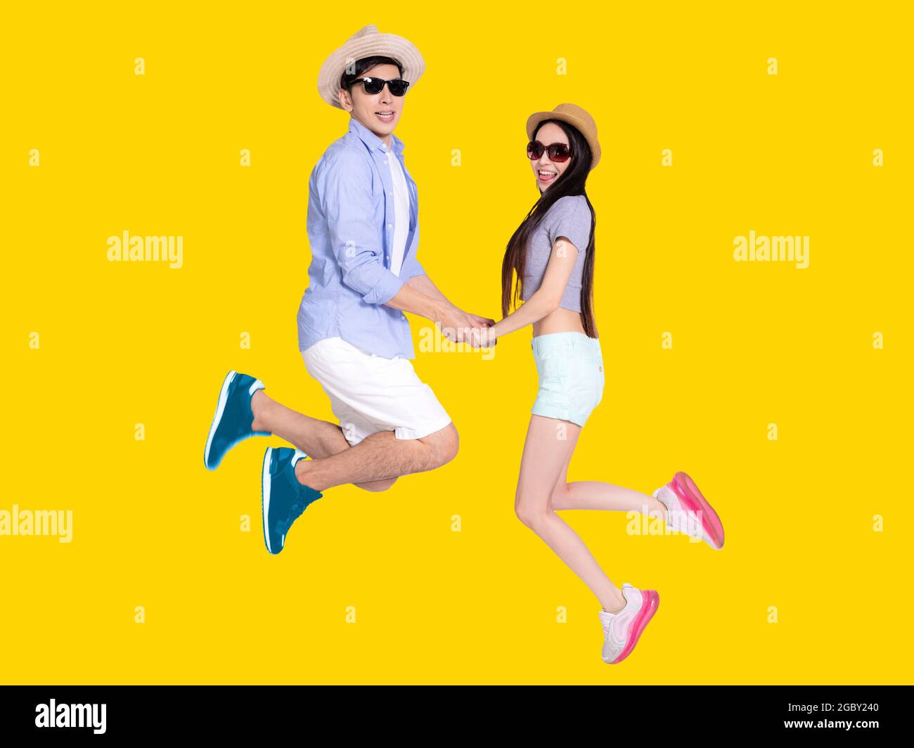 Excited young couple jumping in hi-res stock photography and images - Alamy