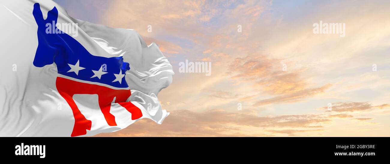 American Democratic party, USA flag waving at sky background on sunset ...