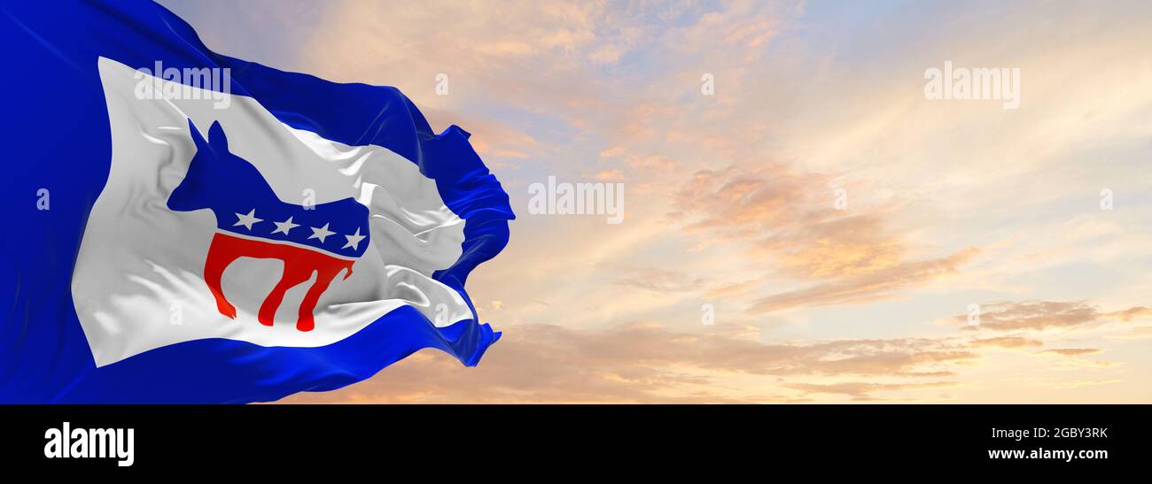 American Democratic party, USA flag waving at sky background on sunset ...