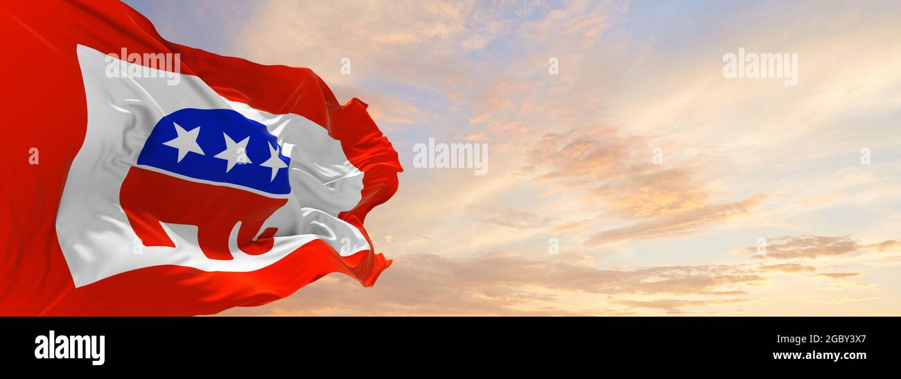 American Republican party, USA flag waving at sky background on sunset ...