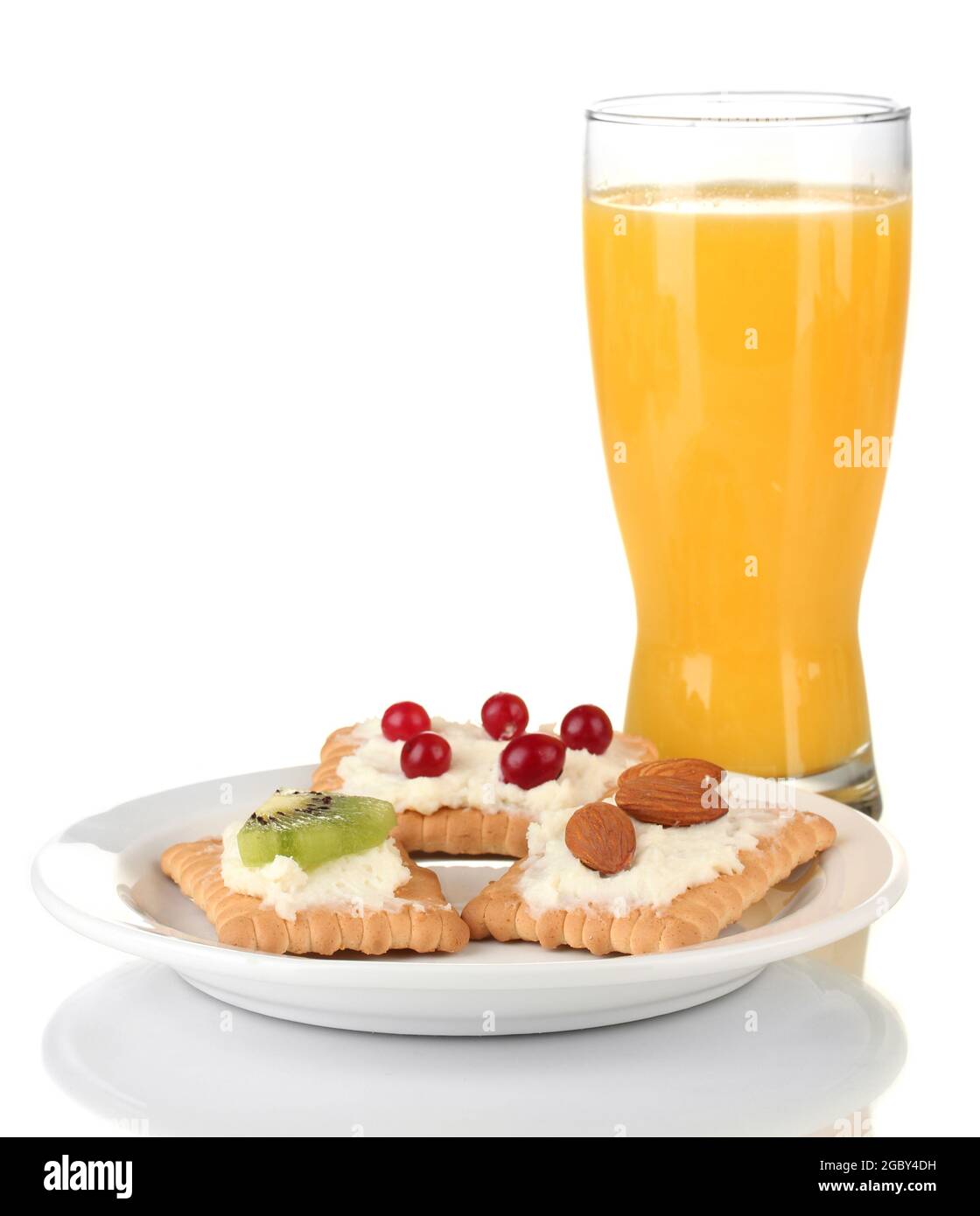 Tasty canapes with cheese, kiwi and cranberry, almond, on color plate ...