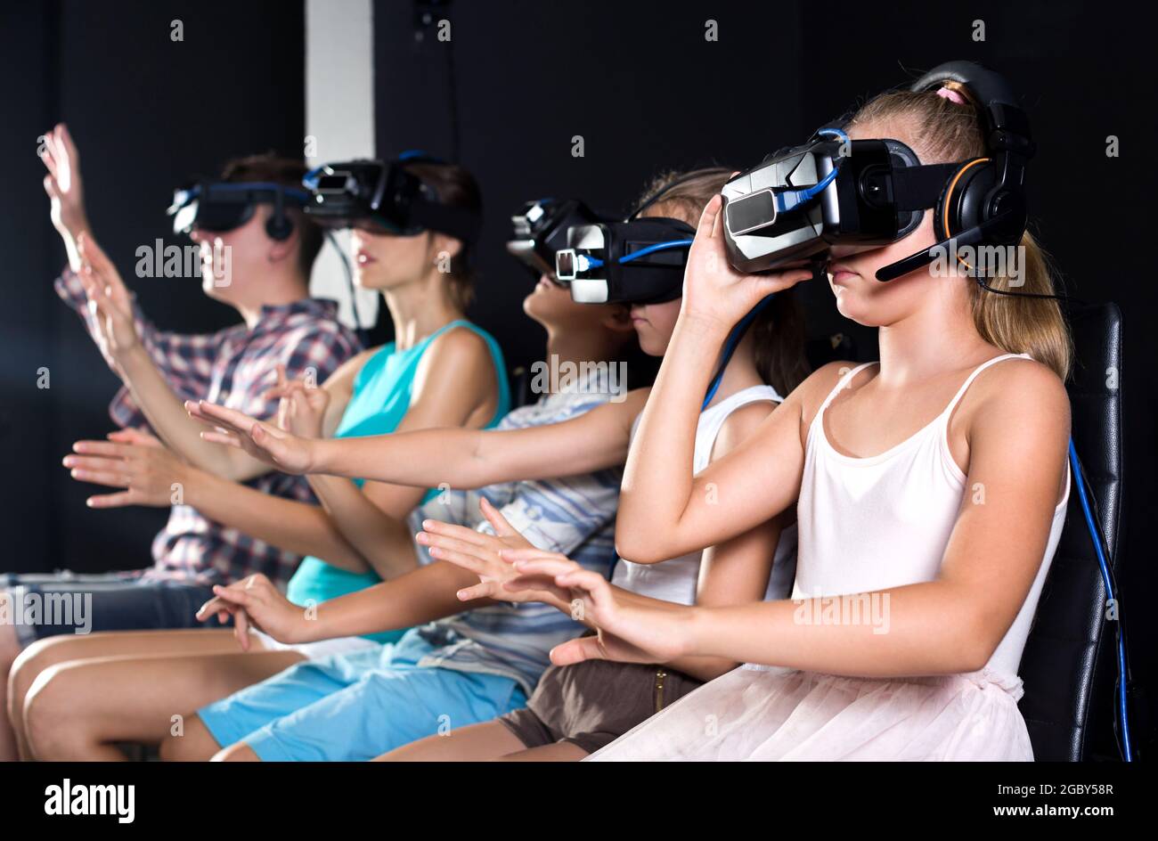Girl is excited by watching the video in VR glasses Stock Photo - Alamy