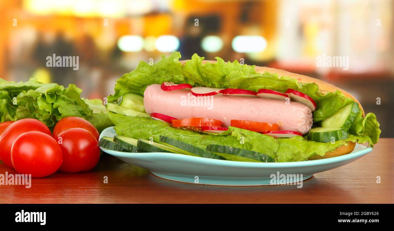 Tasty hot dog on table in cafe Stock Photo - Alamy