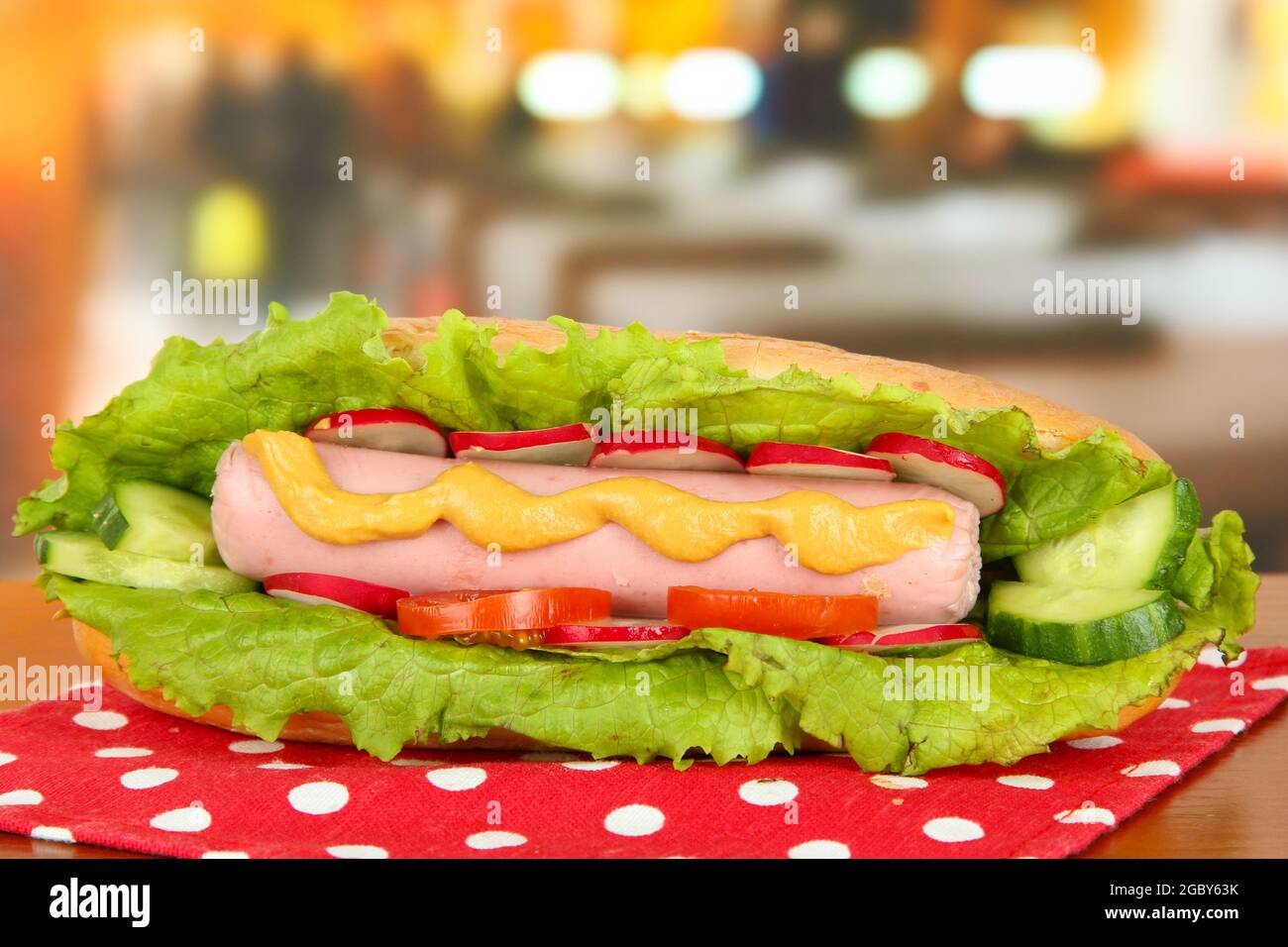 Tasty hot dog on table in cafe Stock Photo - Alamy