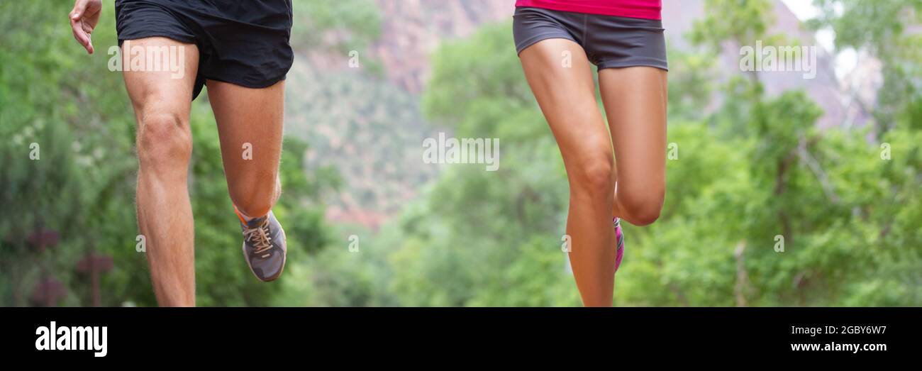 Runners legs banner crop of woman and man athletes running in nature ...