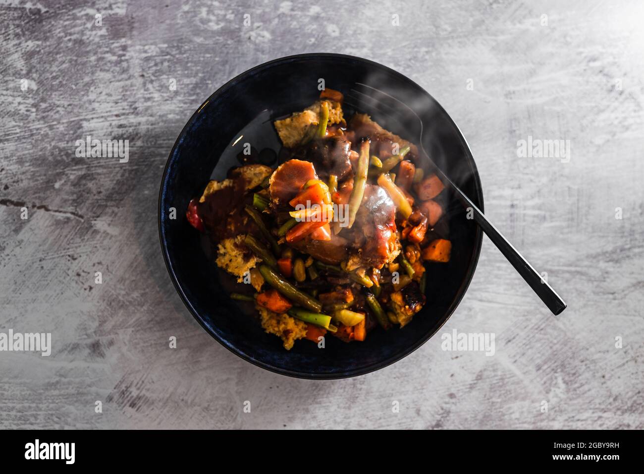 vegan roast with mixed vegetables and plant-based meatloaf slices ...