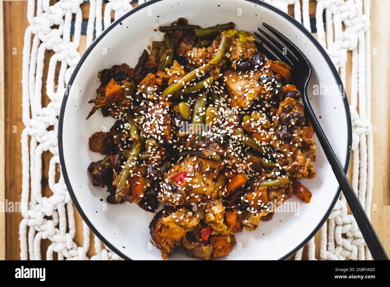 vegan roast with mixed vegetables and plant-based meatloaf slices ...