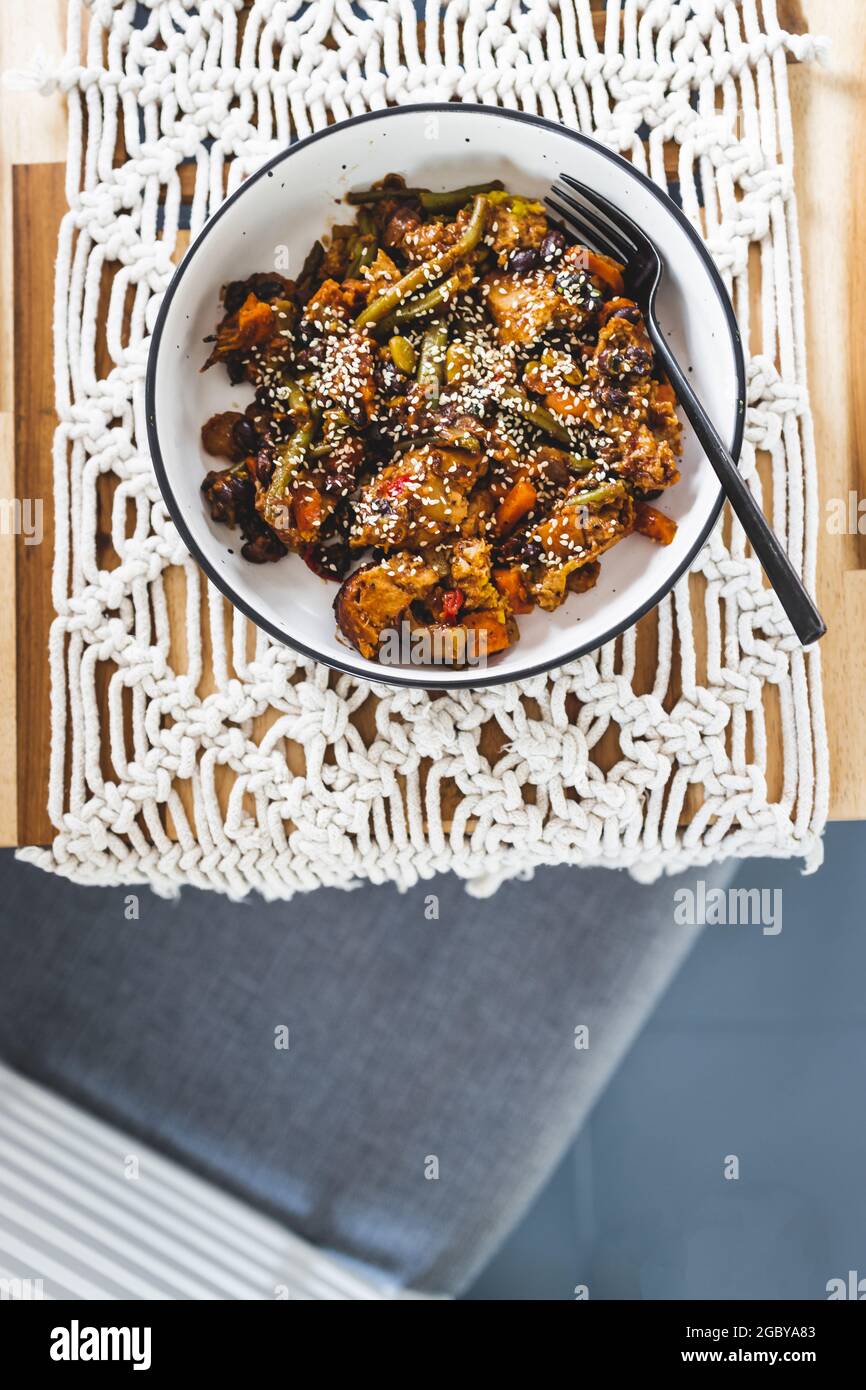 vegan roast with mixed vegetables and plant-based meatloaf slices ...