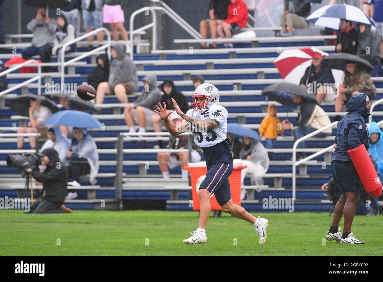 in the rain at the New England Patriots training camp held on the ...