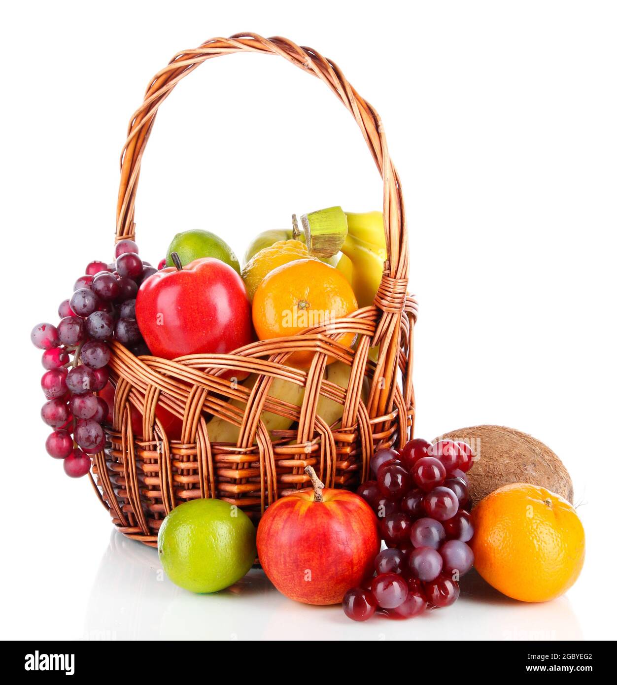 Different fruits in wicker basket isolated on white Stock Photo - Alamy