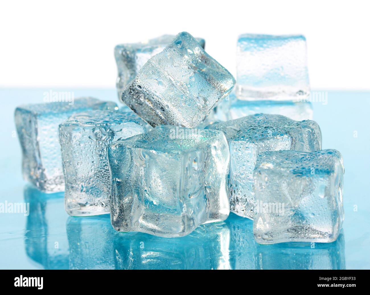 Ice cubes on white background Stock Photo - Alamy