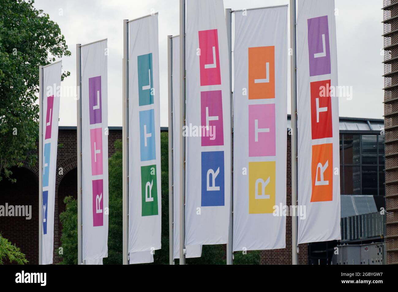 Cologne, Germany. 03rd Aug, 2021. Flags of the TV channel RTL stand on ...