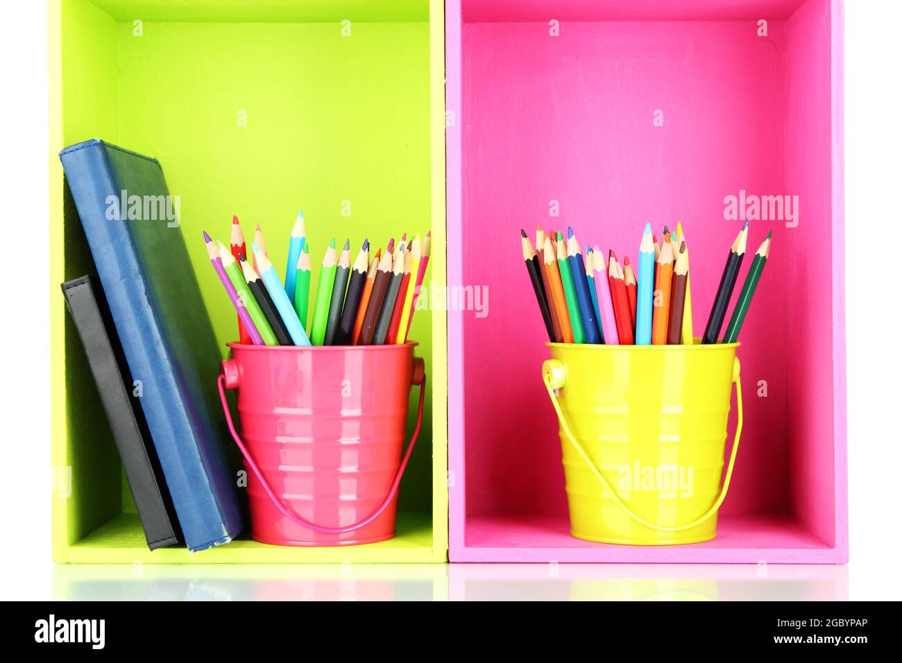 Colorful pencils in pails with writing-pad on shelves Stock Photo - Alamy
