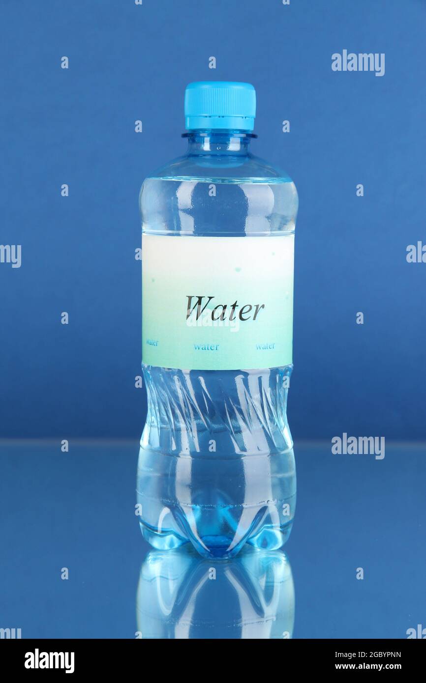 Water bottle with label on blue background Stock Photo - Alamy