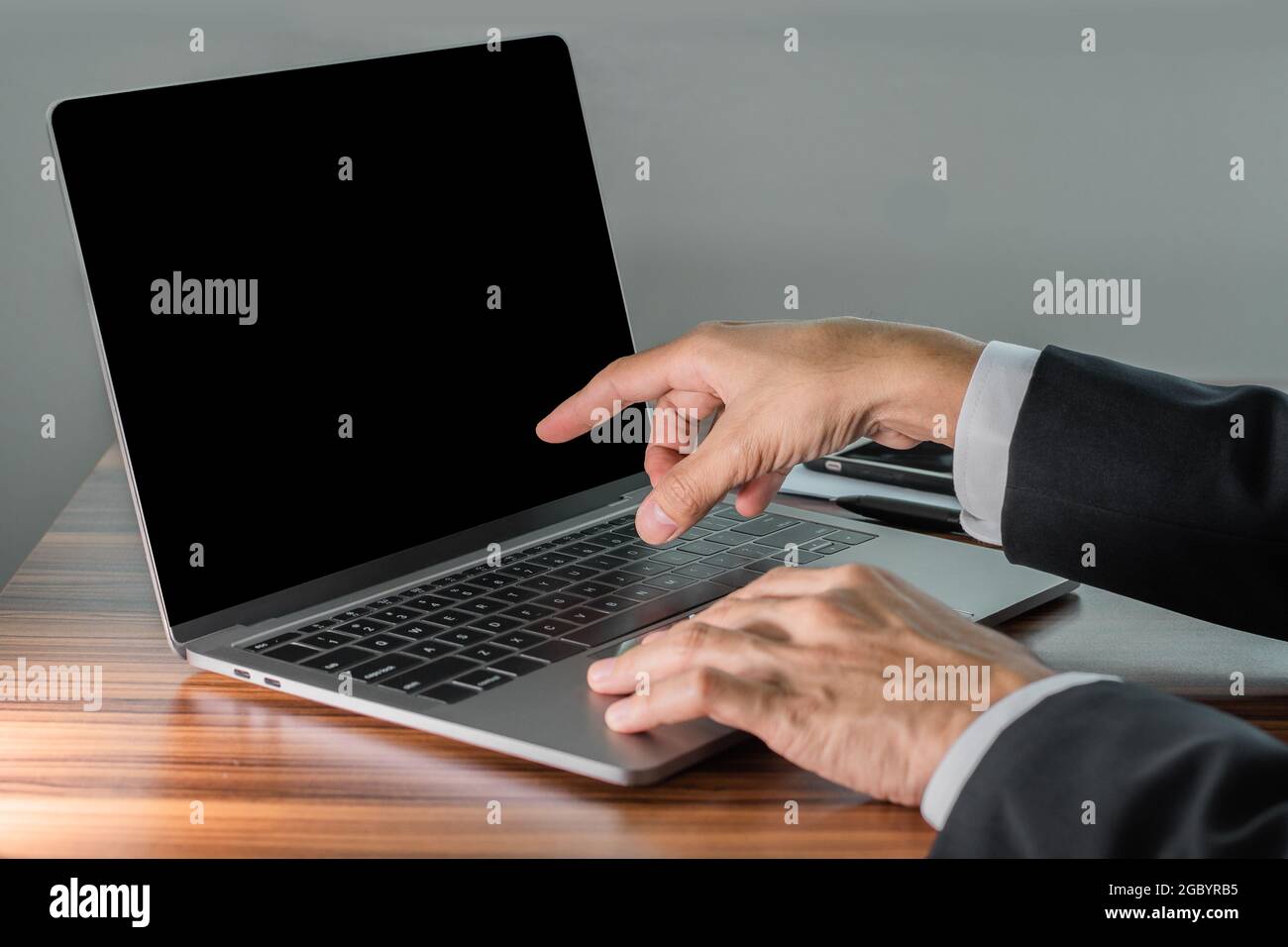 Businessman using computer in office, Hand touch on screen monitor ...