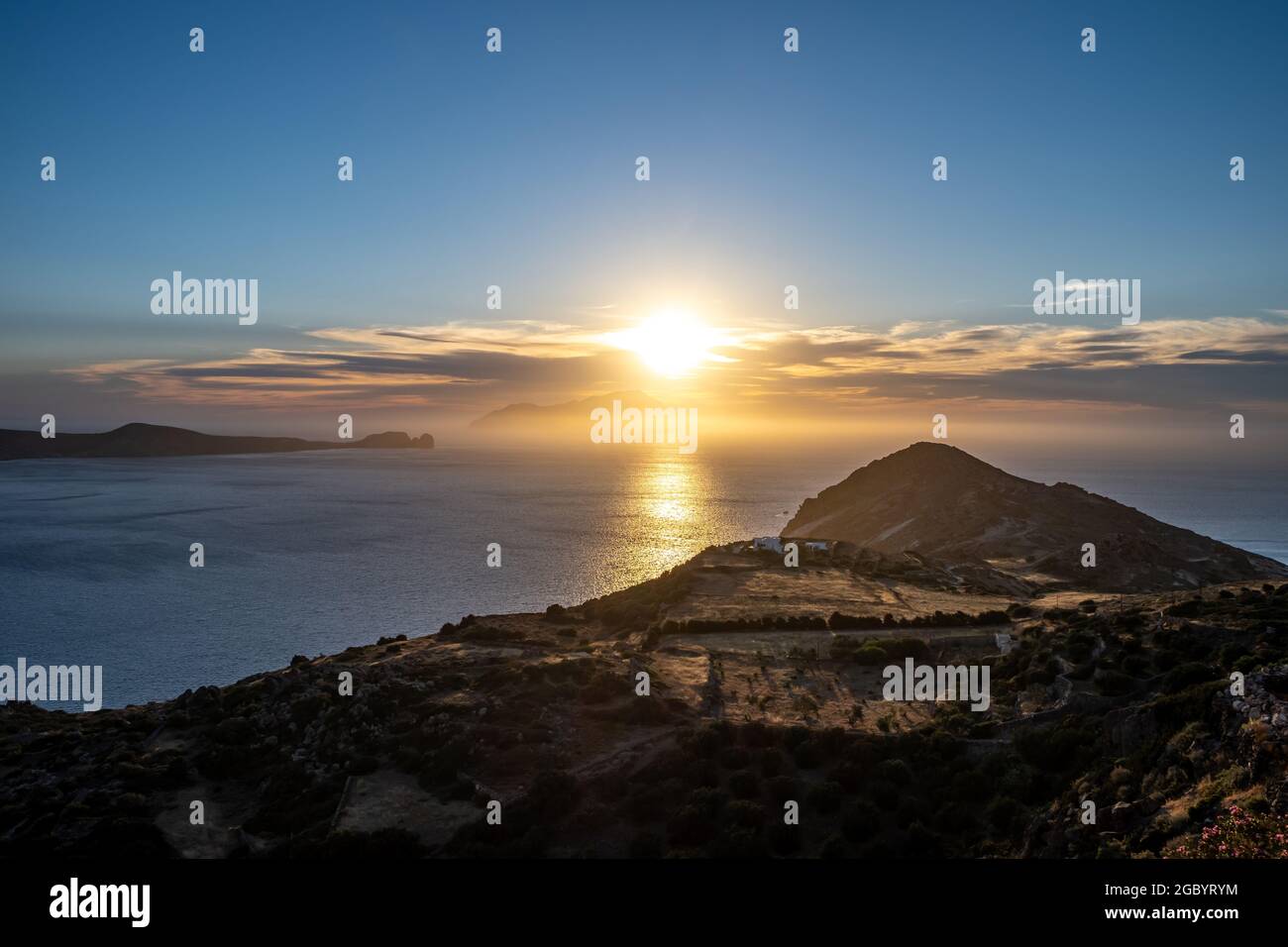 Sunset over Aegean sea concept. Sunbeams colors with yellow and orange ...