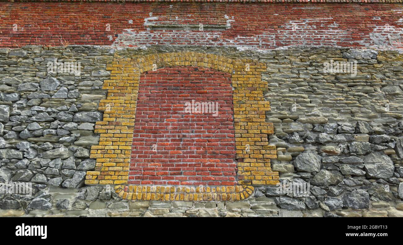 Fake window in a brick and stone wall, for backgrounds, texture. Street ...