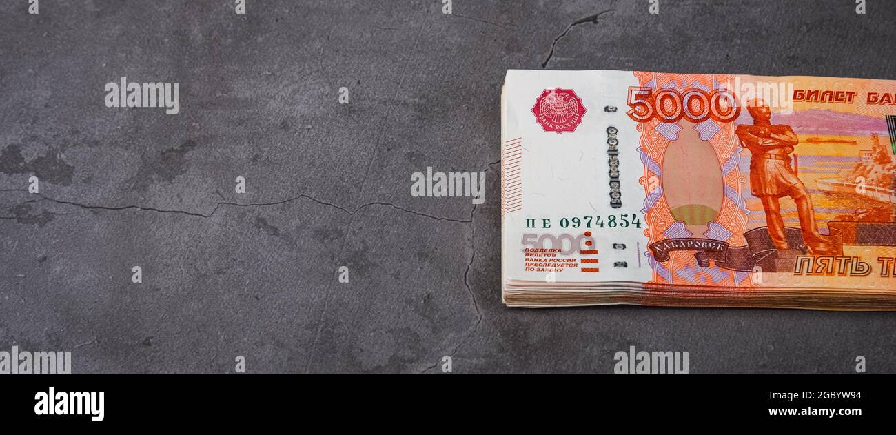 Russian rubles a large bundle on a gray background. A bundle of five ...