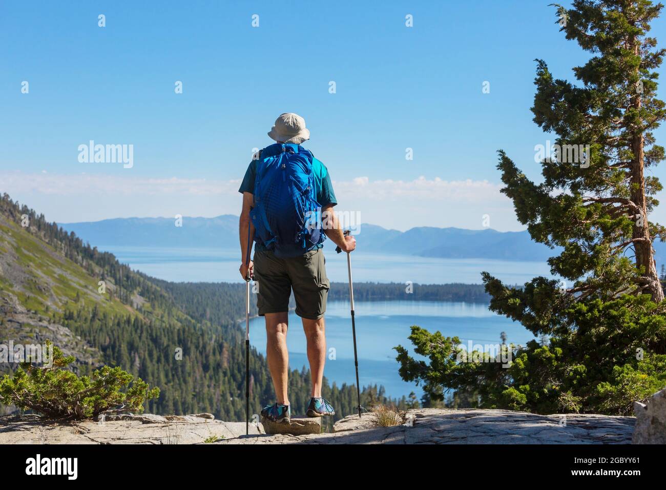 Backpacker in hike in the high mountains Stock Photo - Alamy