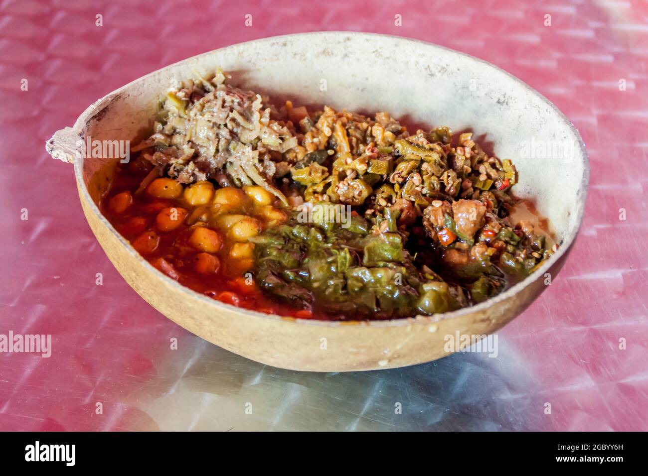 Meal consisting of beans, vegetables and achar, served in calabash ...