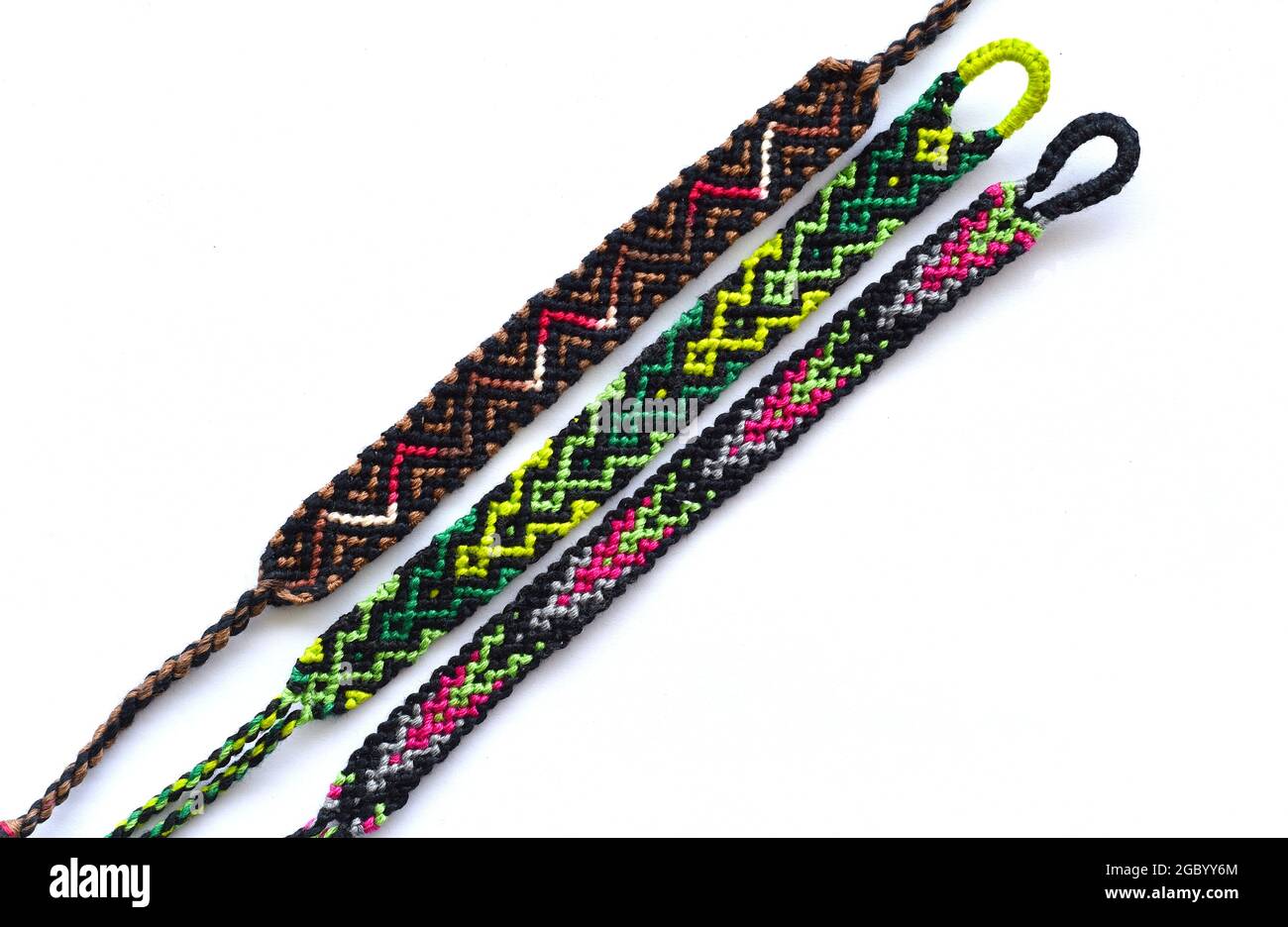 DIY woven friendship bracelets with straight braiding. Summer accessory ...
