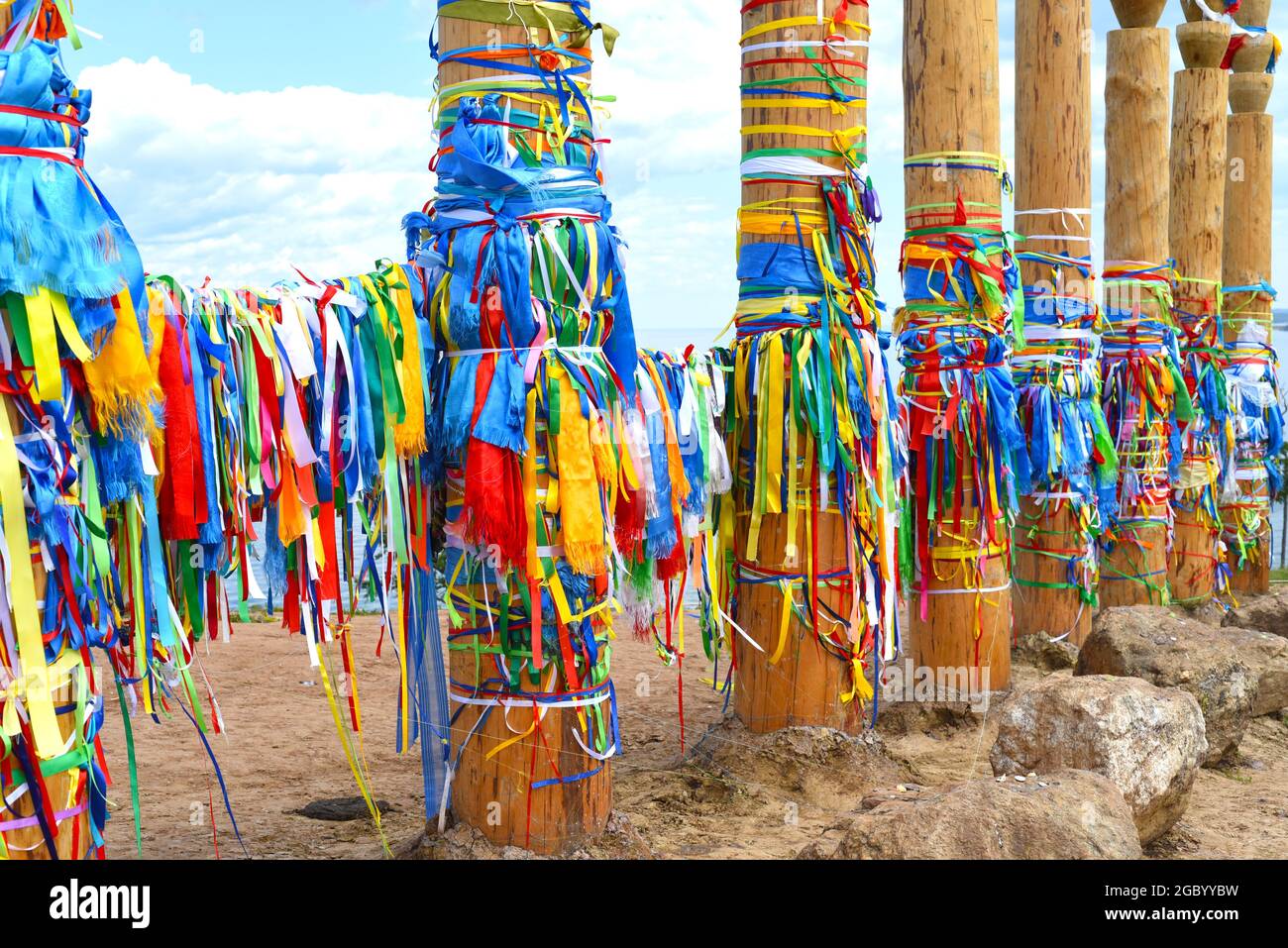 Colorful ribbons on hitching posts of shamanism religion in Khuzhir ...