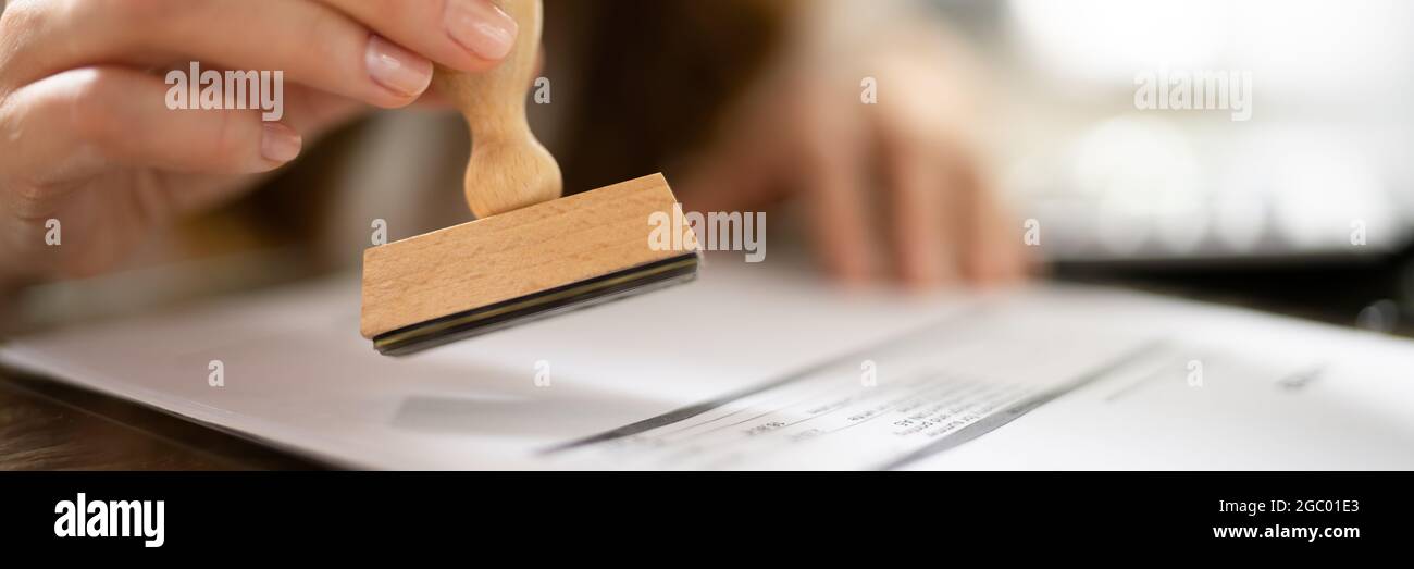 Notary Rubber Stamp In Hand. Official Paper Approved Stock Photo - Alamy