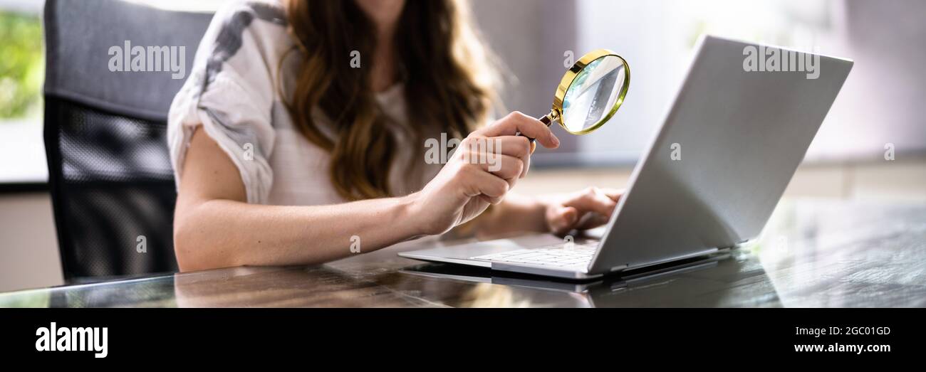 Searching Online Content On Laptop Computer Using Magnifying Glass ...