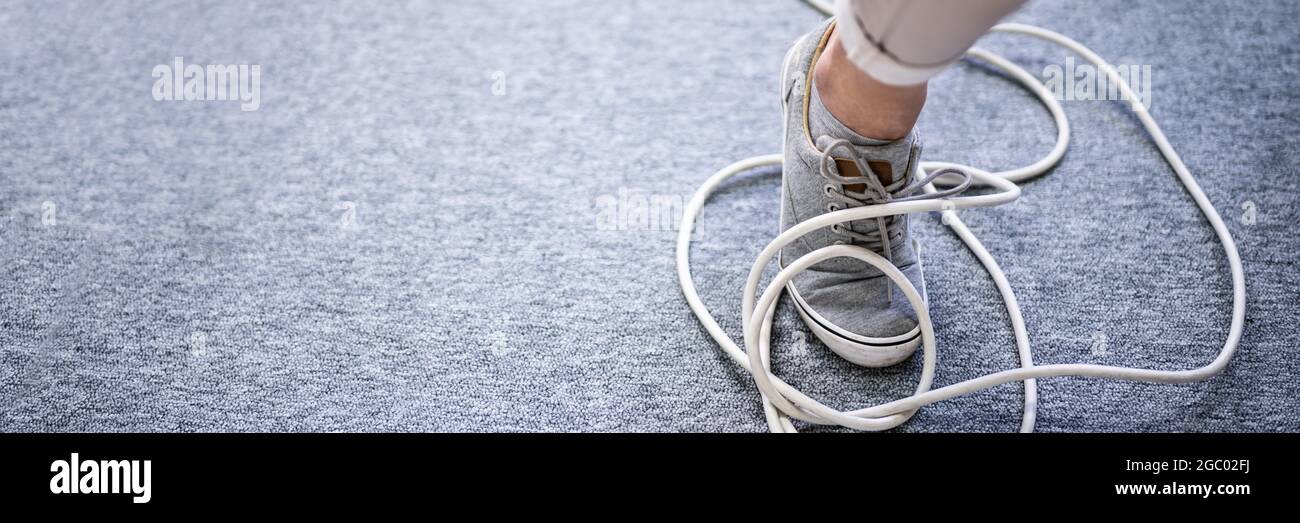 Trip Over Wire Cable Or Cable And Fall Stock Photo - Alamy