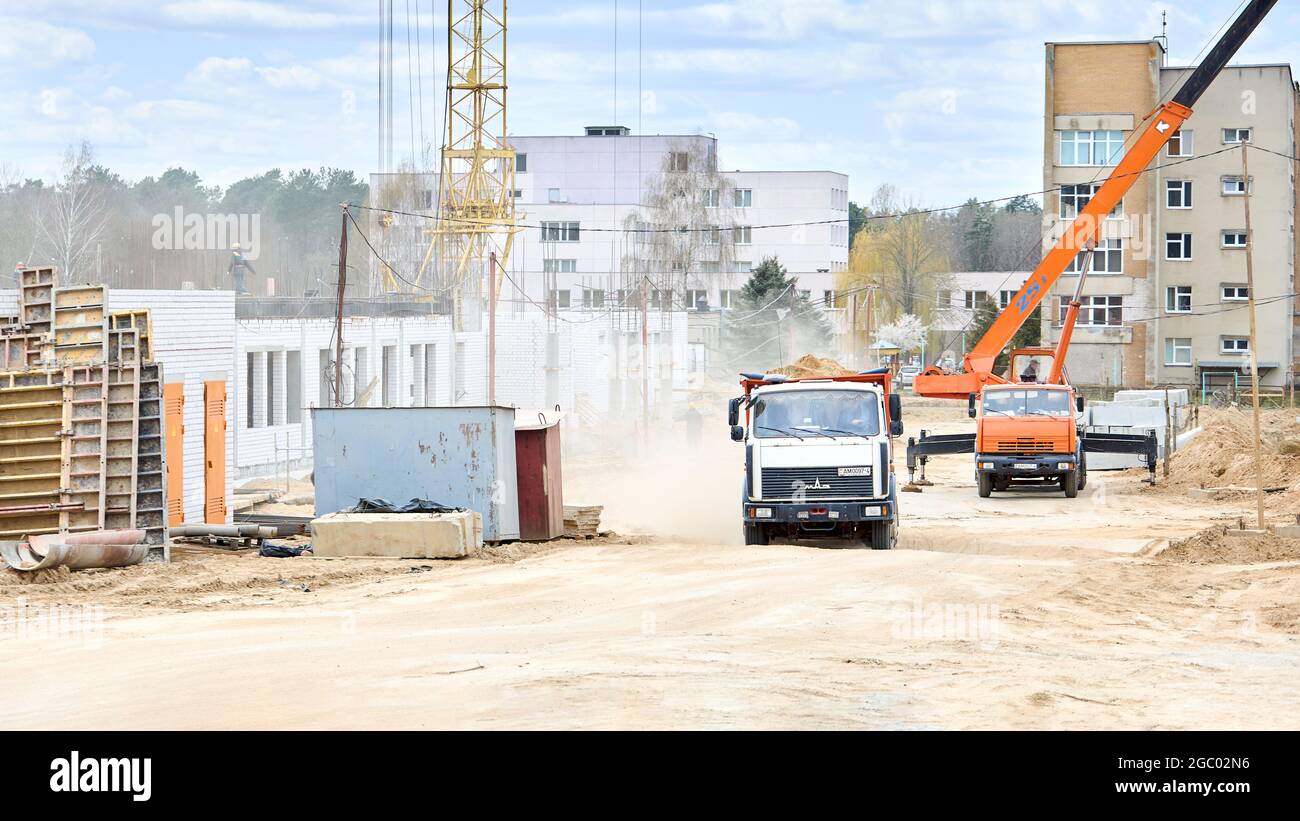 Grodno - April 2020: Crane and heavy lorry on construction site ...