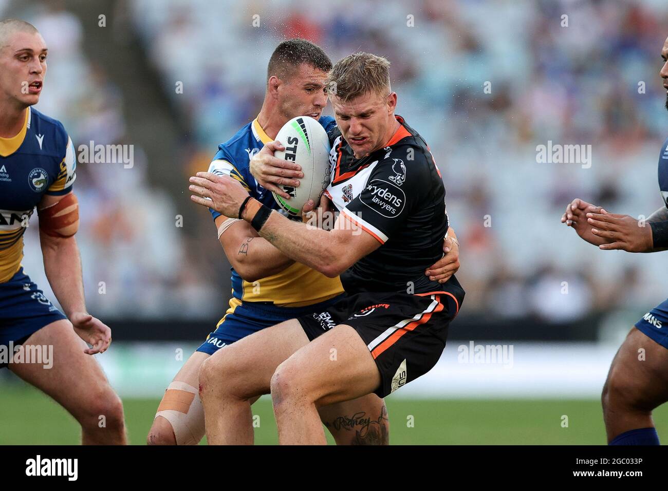 SYDNEY, AUSTRALIA - APRIL 05: Luke Garner of the Tigers is tackled ...