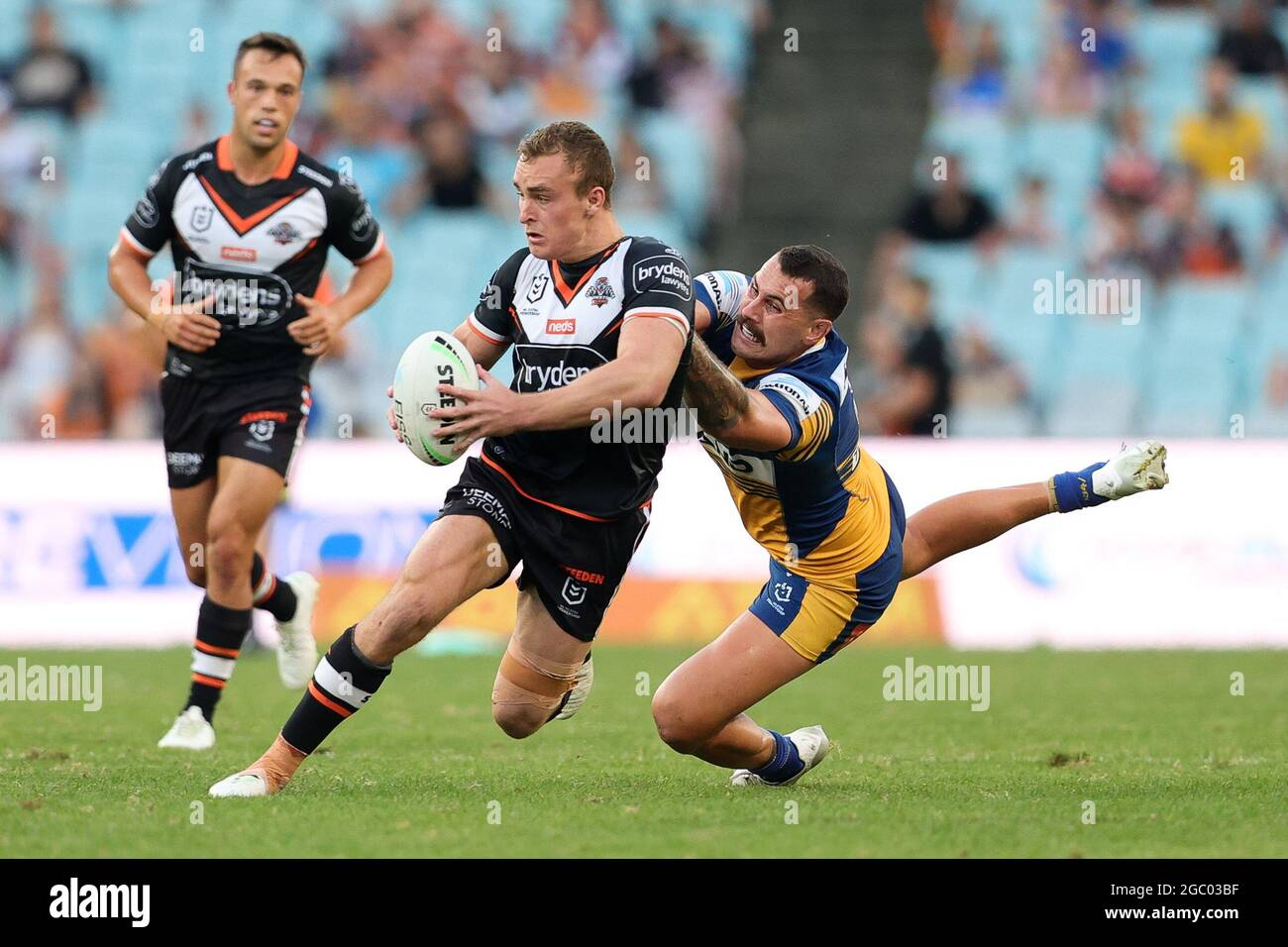 SYDNEY, AUSTRALIA - APRIL 05: Jacob Liddle of the Tigers is tackled by ...