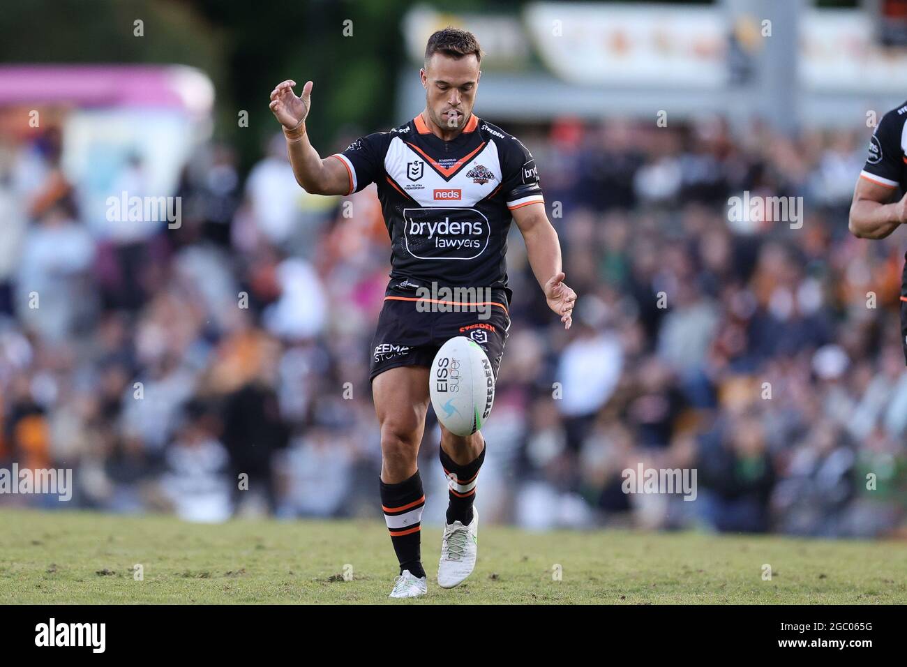 SYDNEY, AUSTRALIA - APRIL 11: Luke Brooks of the Tigers kicks in play ...