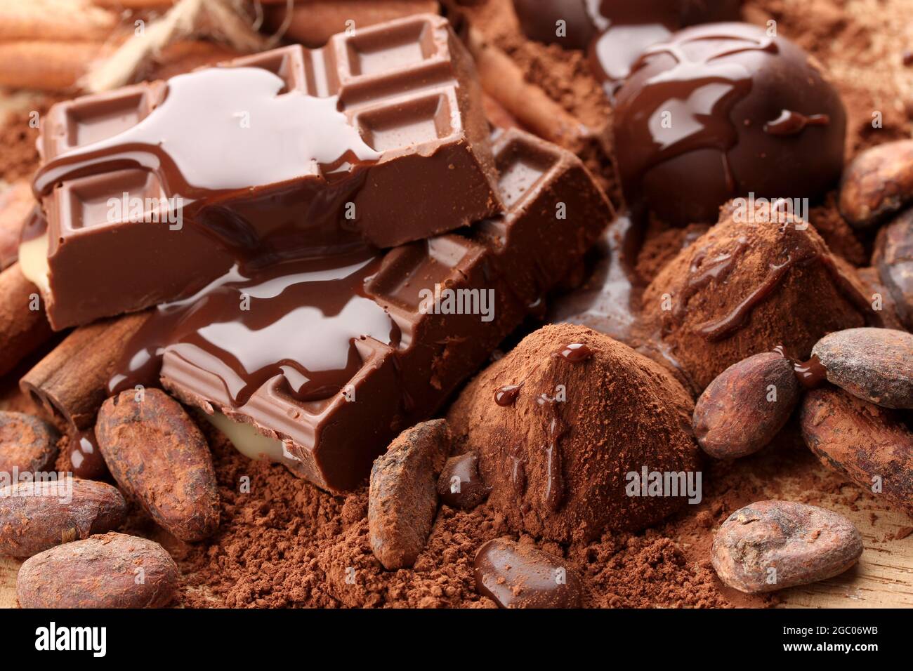 Composition of chocolate sweets, cocoa and spices Stock Photo - Alamy