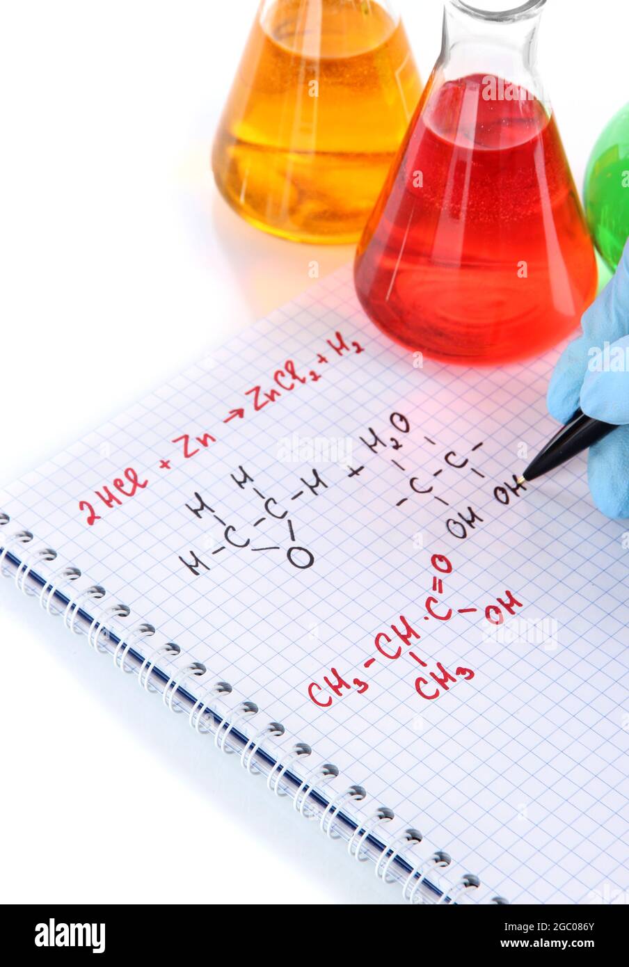 Test tubes with colorful liquids and formulas isolated on white Stock ...